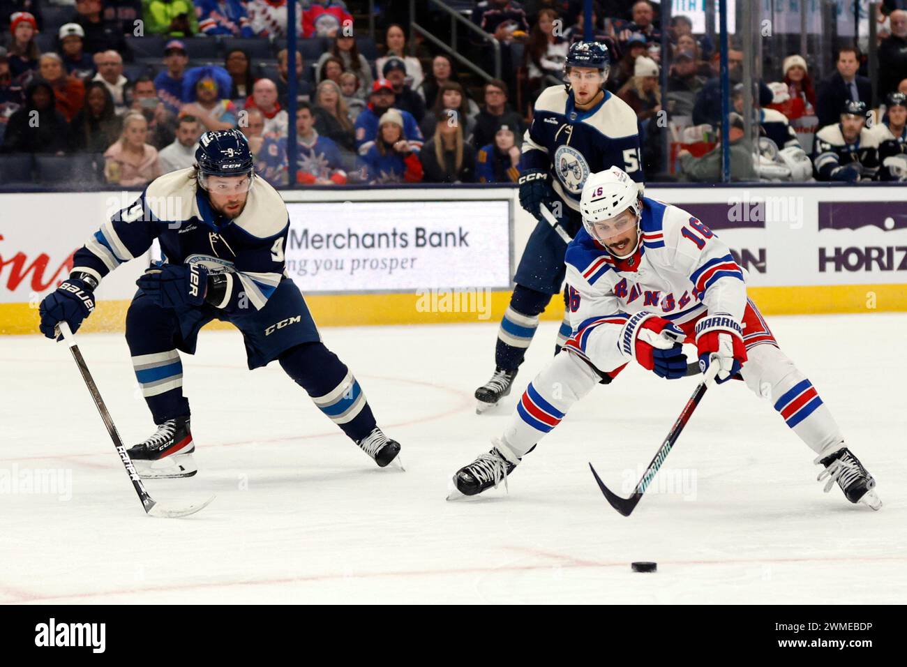 New York Rangers forward Vincent Trocheck, right, reaches for the puck ...