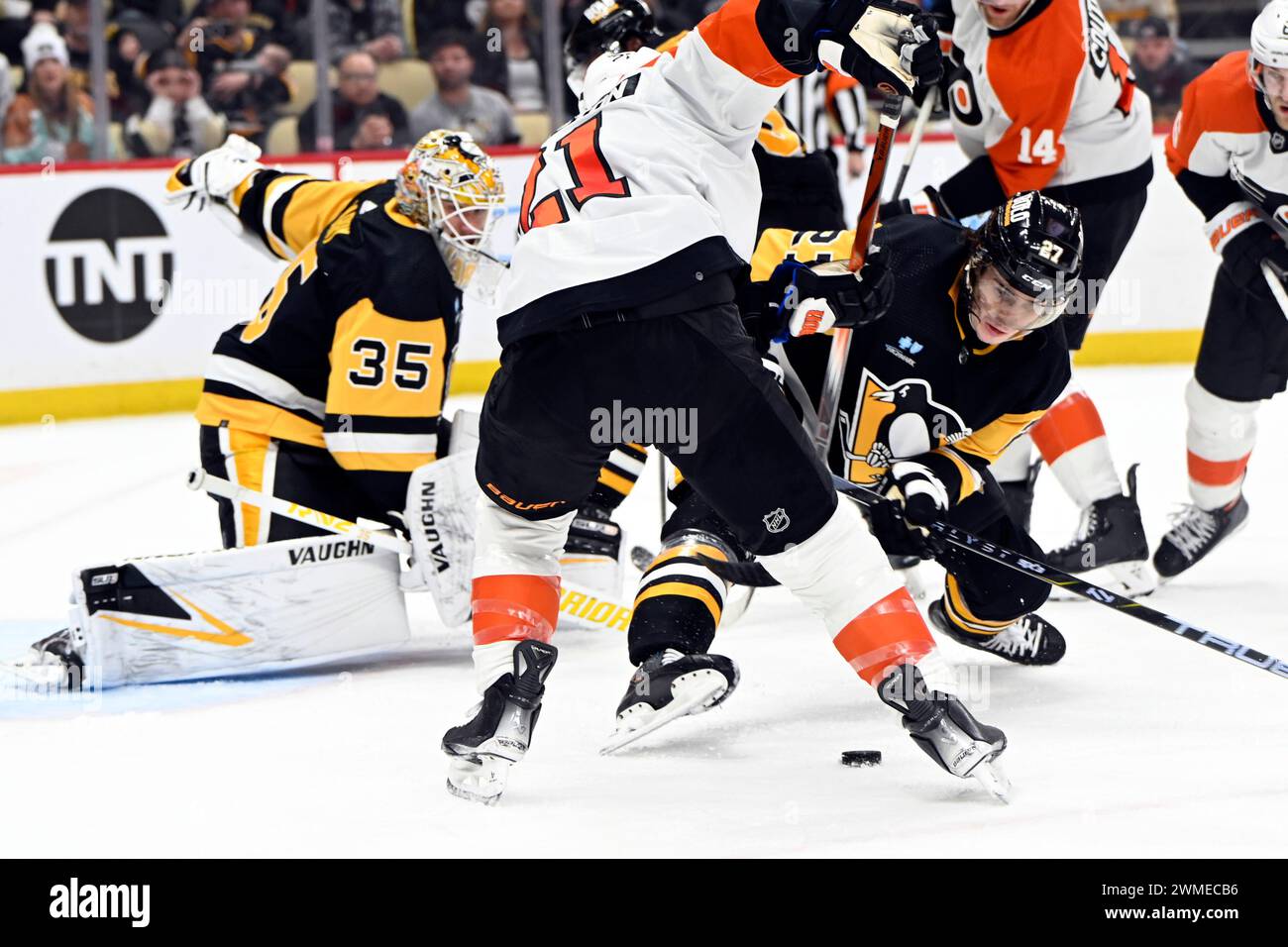 Pittsburgh Penguins defenseman Ryan Graves (27) applies pressure on ...