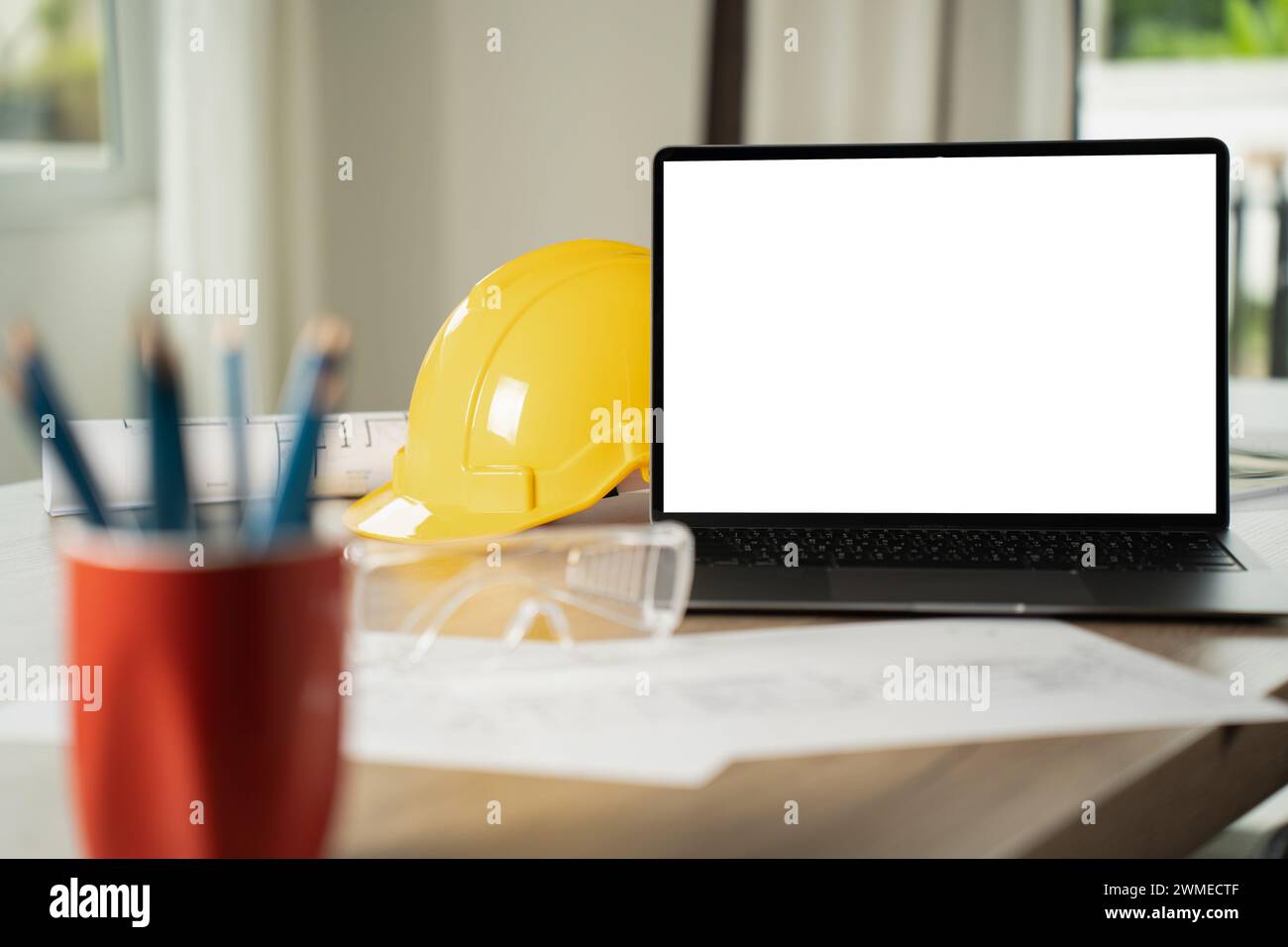 man engineer working on desktop computer with building structures in ...