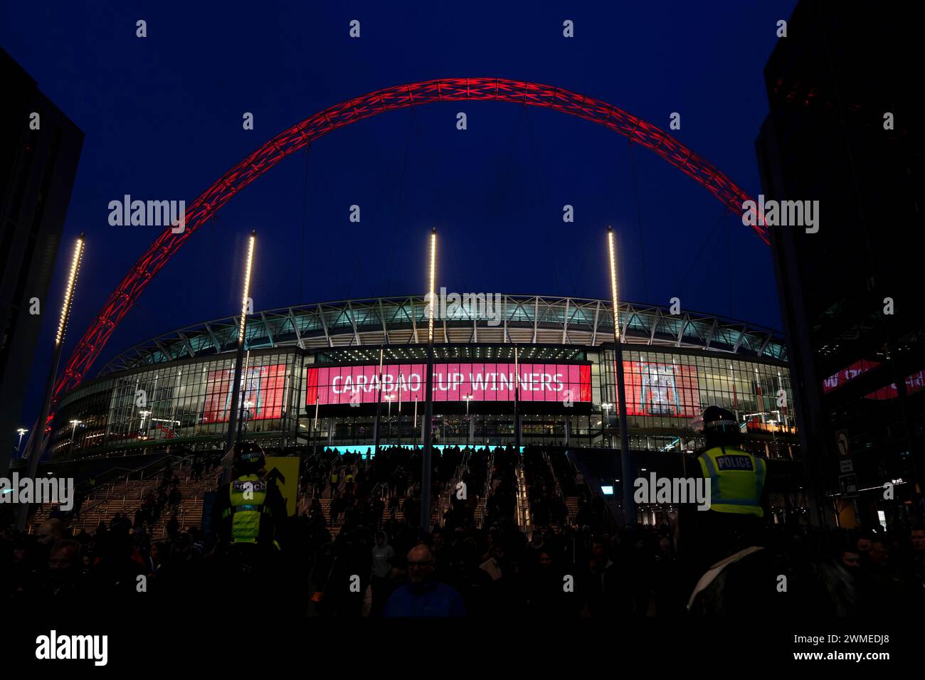 The Wembley arch is lit up in red after Liverpool win the the Carabao ...
