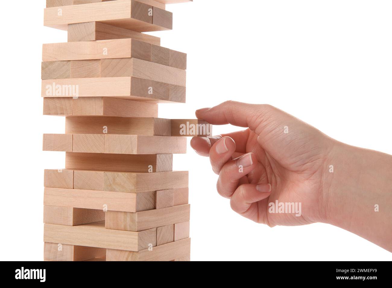 Woman playing Jenga on white background, closeup Stock Photo - Alamy