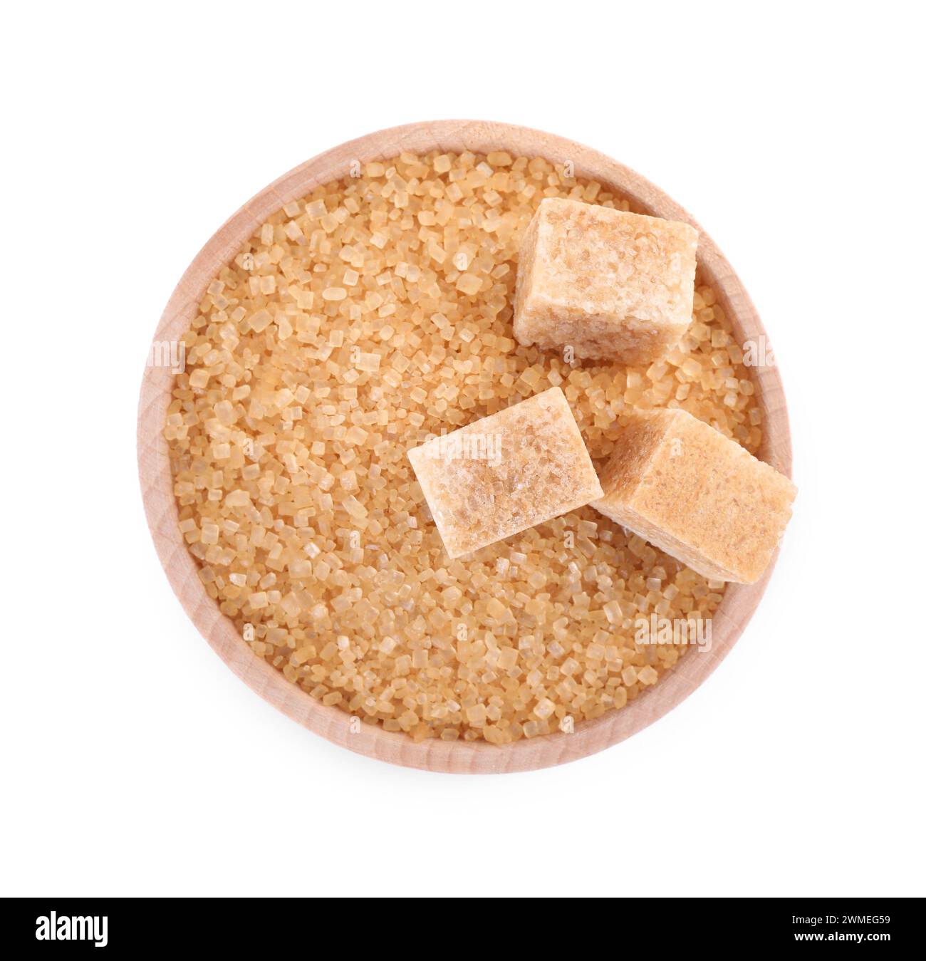 Different types of brown sugar in bowl isolated on white, top view ...