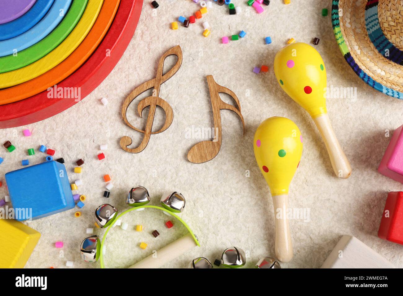 Baby song concept. Wooden notes, kids musical instruments and toys on ...