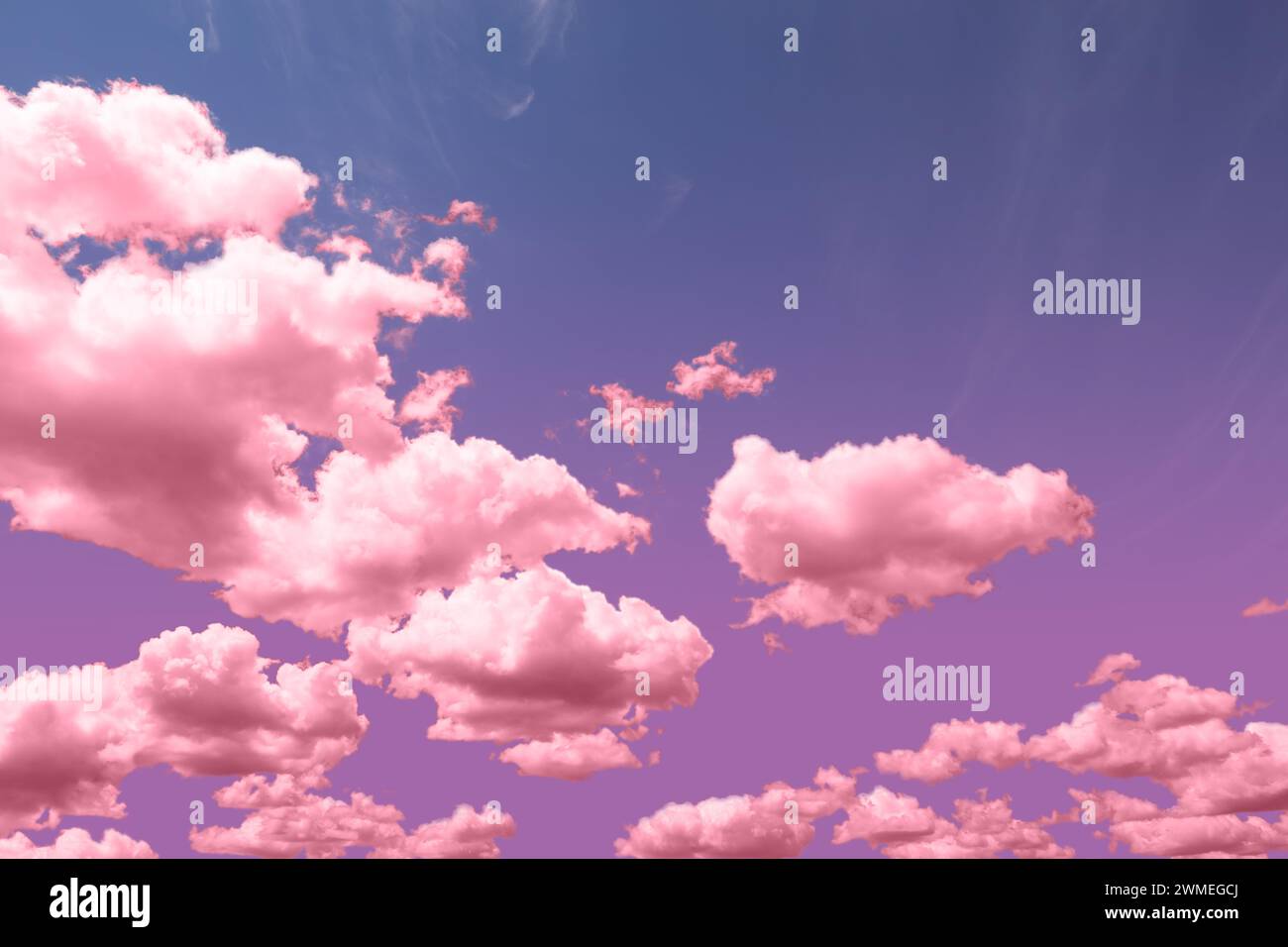 Pink fluffy clouds floating in beautiful sky Stock Photo - Alamy