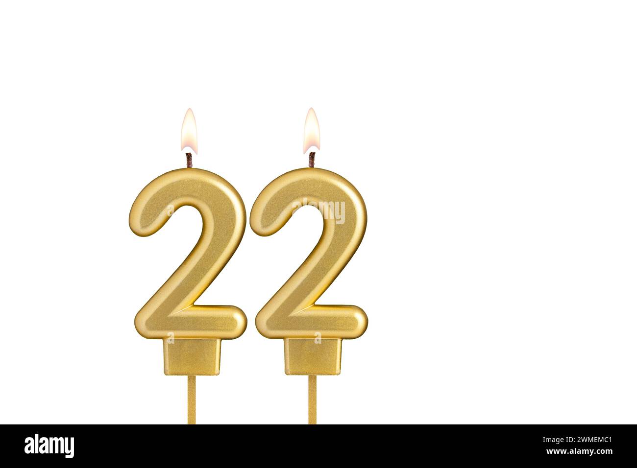 Golden number 22 birthday candle on white background Stock Photo - Alamy