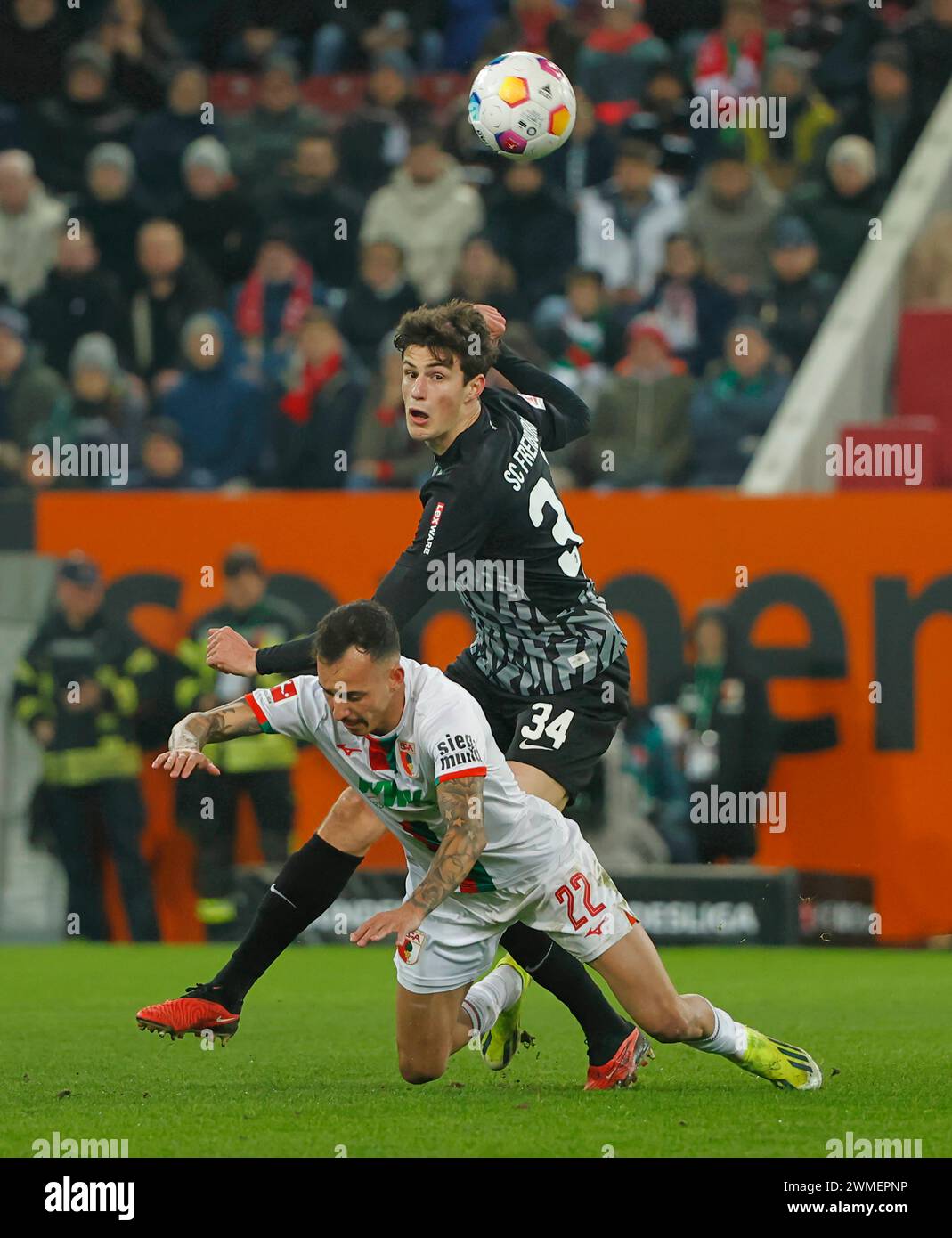 Augsburg, Germany. 25th Feb, 2024. Iago Amaral Borduchi (bottom) of ...