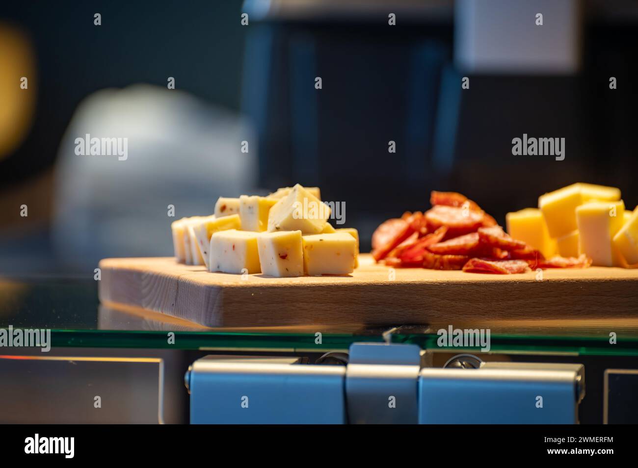 Tasting of different cheeses and sausages in Dutch cheese farm shop ...