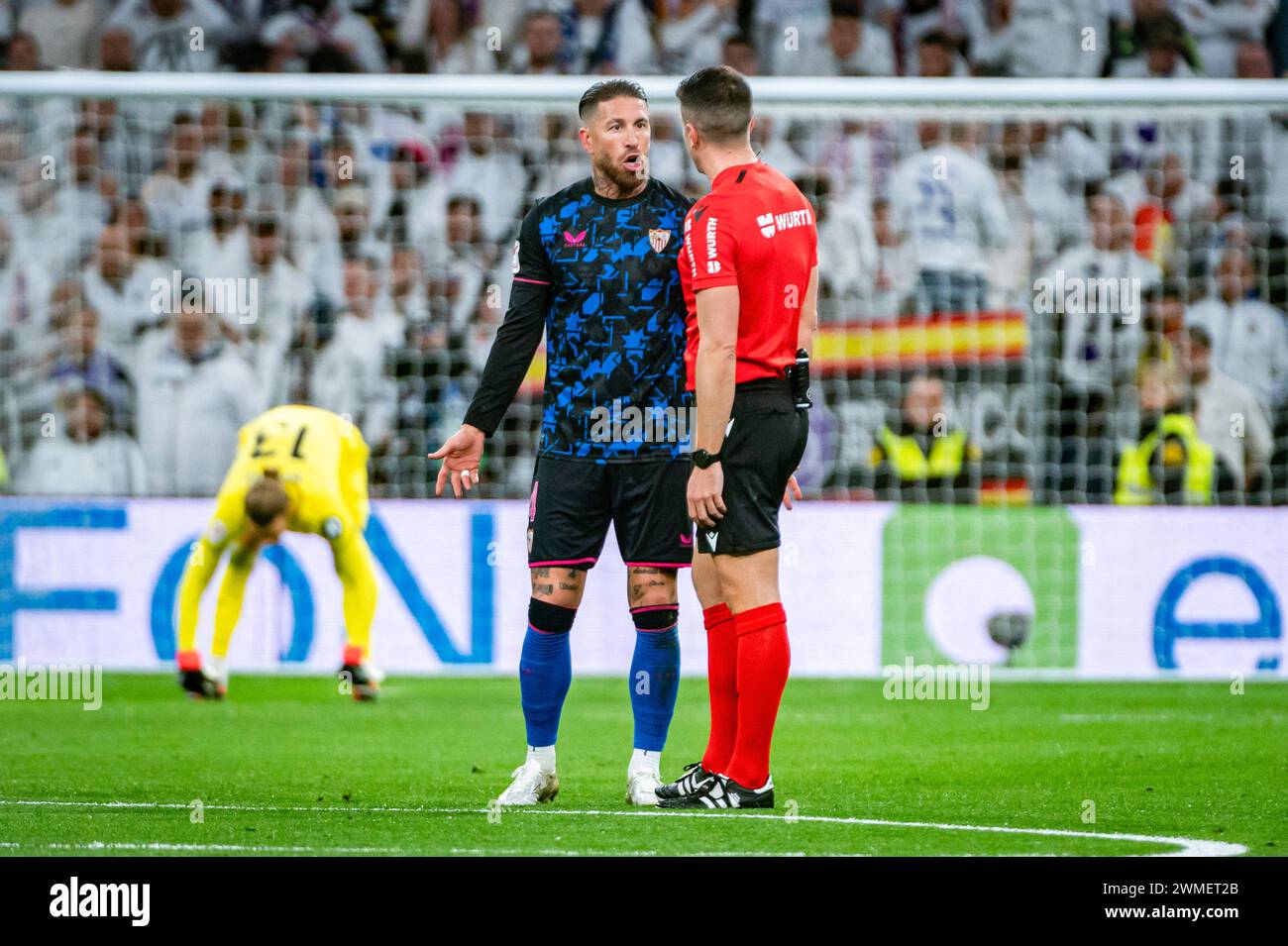 Madrid, Spain. 25th Feb, 2024. Sergio Ramos of Sevilla (L) seen arguing ...