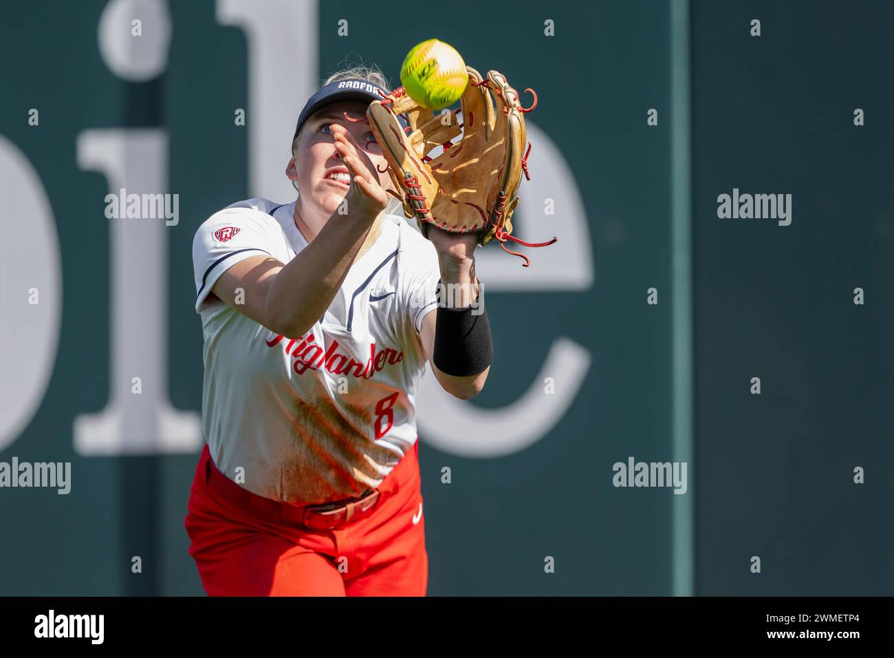 Radford University outfielder Abby Bossier (8) catches a fly ball ...