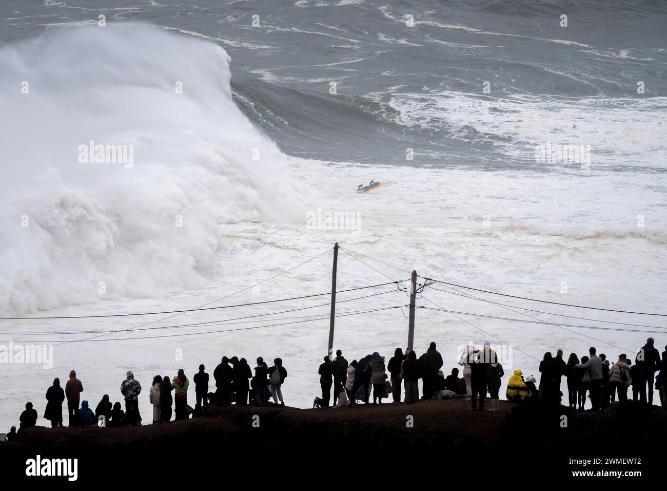 People watch a giant wave in Nazaré. Friday 23 and Saturday 24 February ...