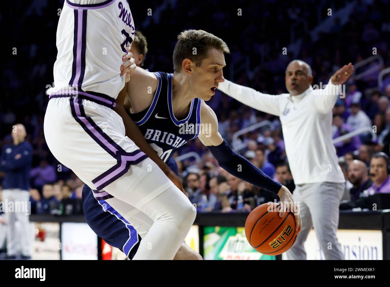 BYU guard Spencer Johnson, center, gets past a Kansas State defender as ...