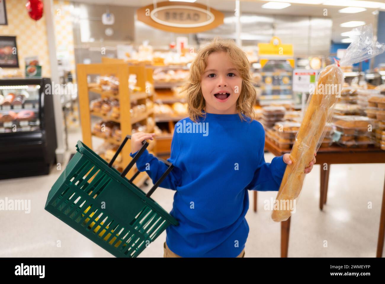 Child at vegetable supermarket. Little kid choosing food in store or ...