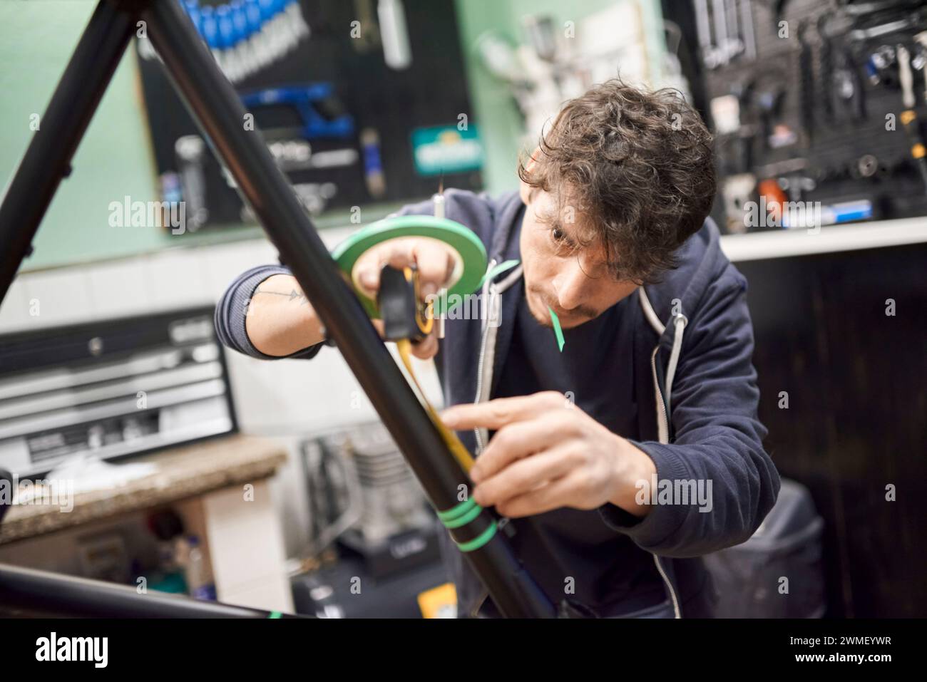 Man taking measurements with a tape measure, process of preparing a ...
