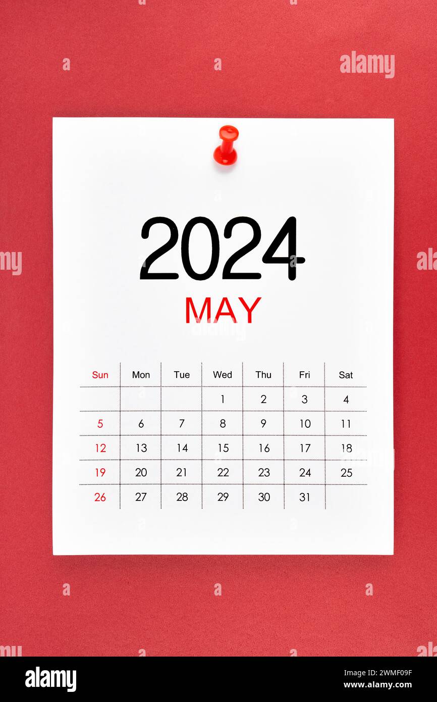 May 2024 calendar page with push pin on red background Stock Photo - Alamy
