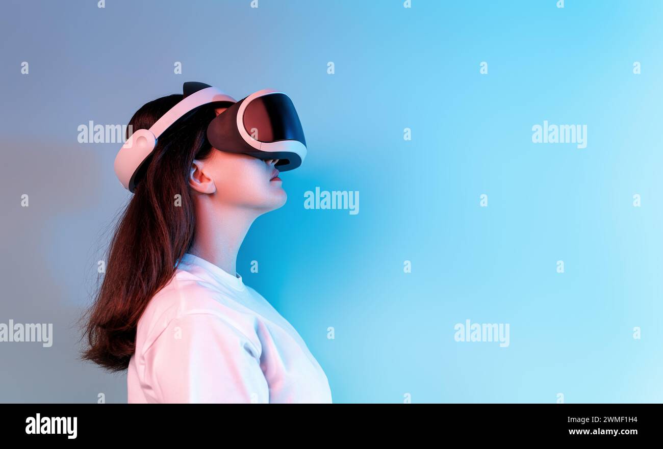 Metaverse technology concept. Woman with VR virtual reality goggles on ...