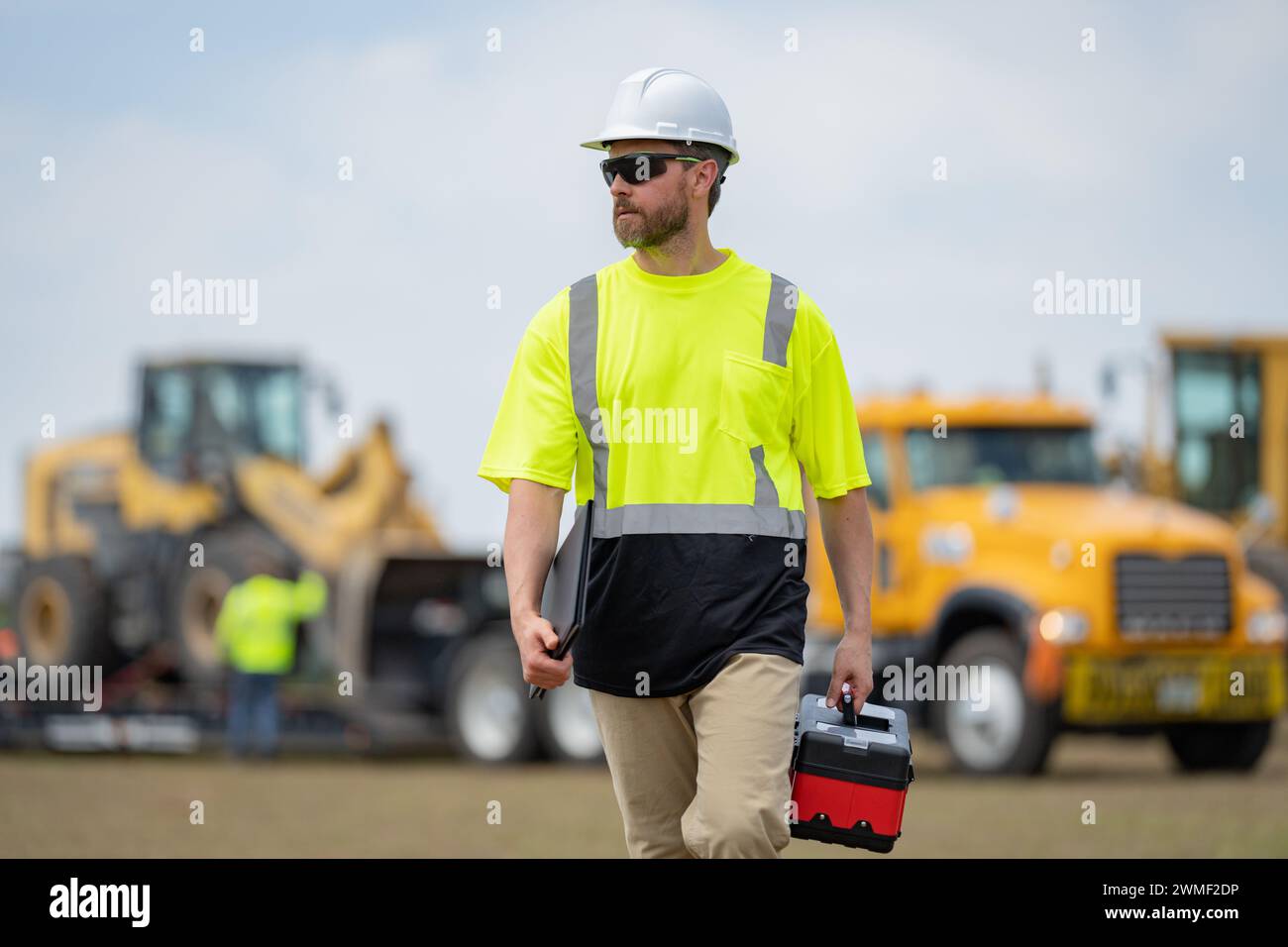 The Builder. Worker man in helmet on construction site. Inspector Man ...