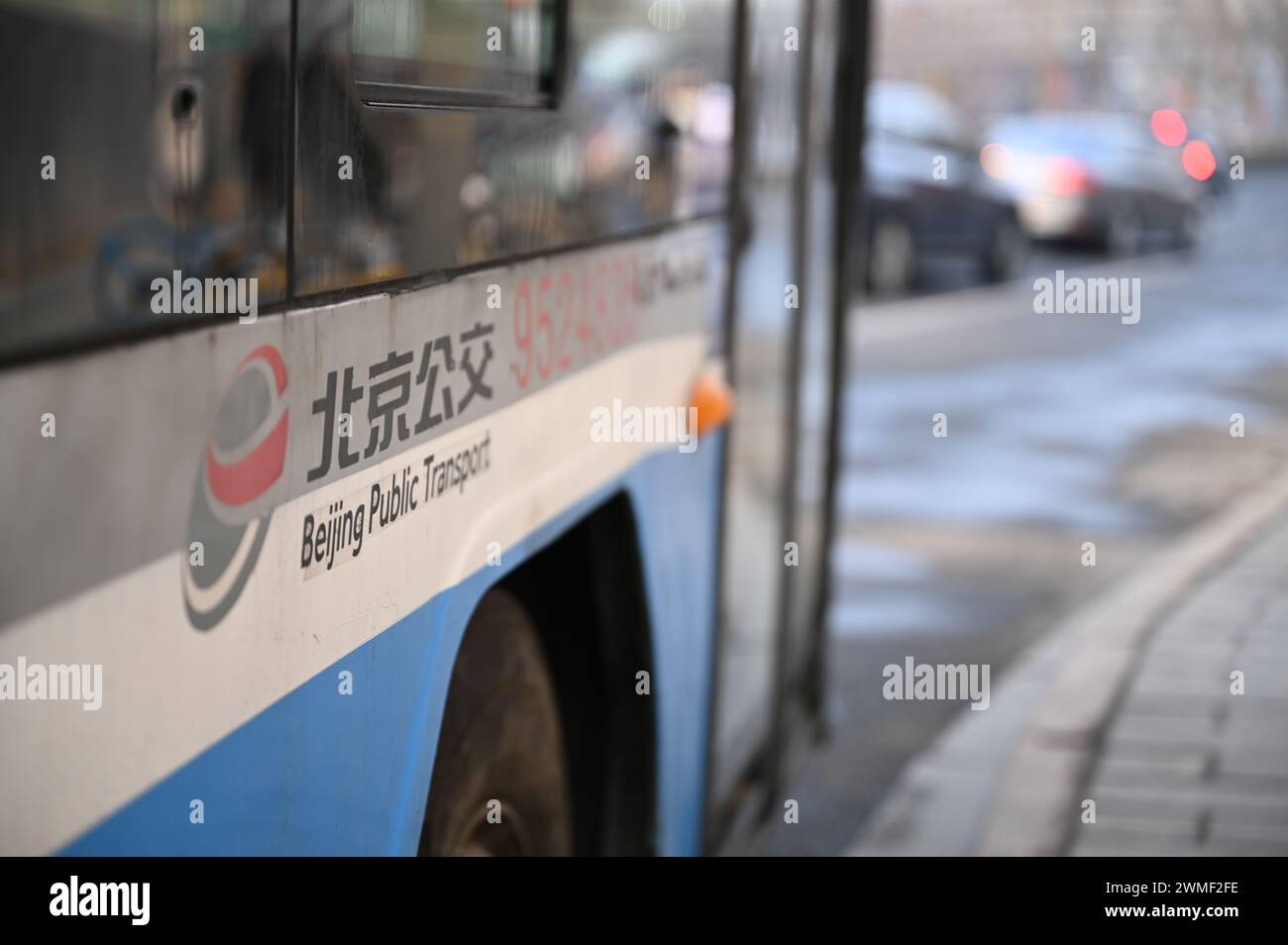 Peking, China. 26th Feb, 2024. A public transport bus in Beijing bears ...