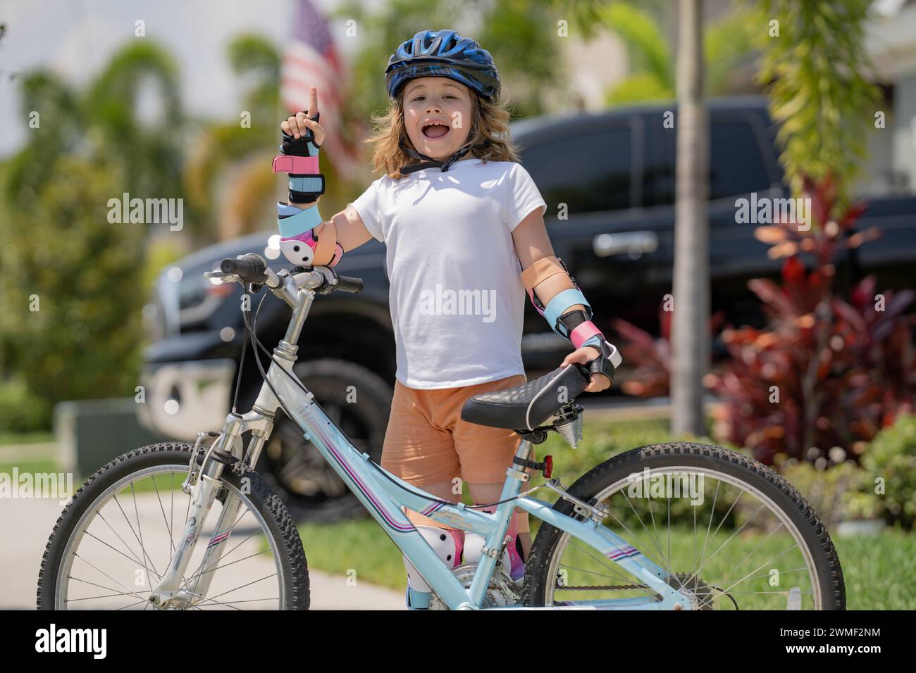 Kid ride bike. Child riding bicycle. Little kid boy in helmet on ...