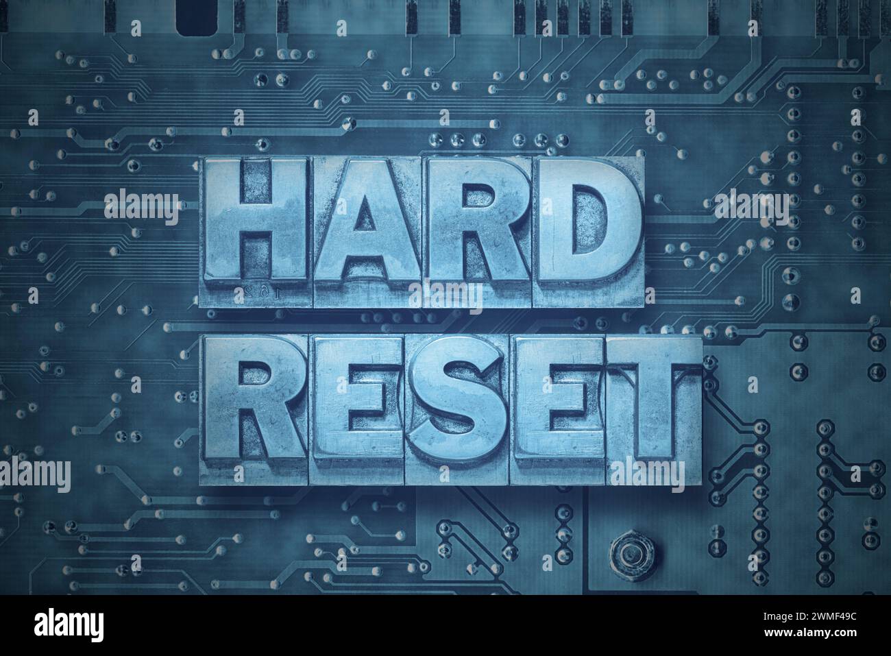 hard reset phrase made from metallic letterpress blocks on the pc board ...