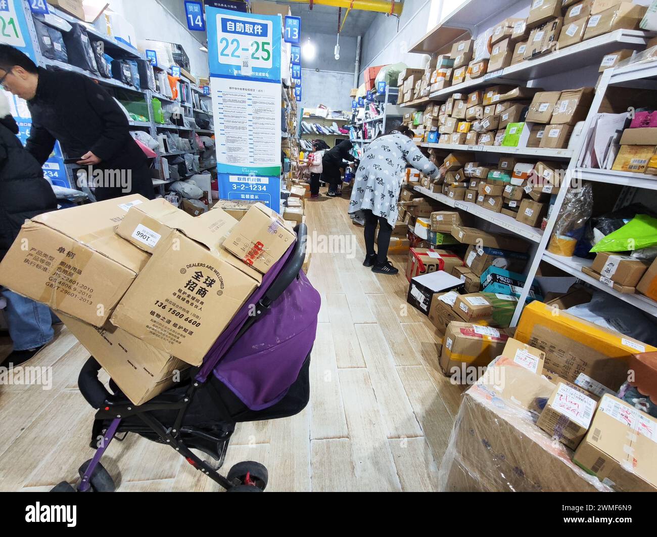 ENSHI, CHINA - FEBRUARY 21, 2024 - A express delivery station is filled ...