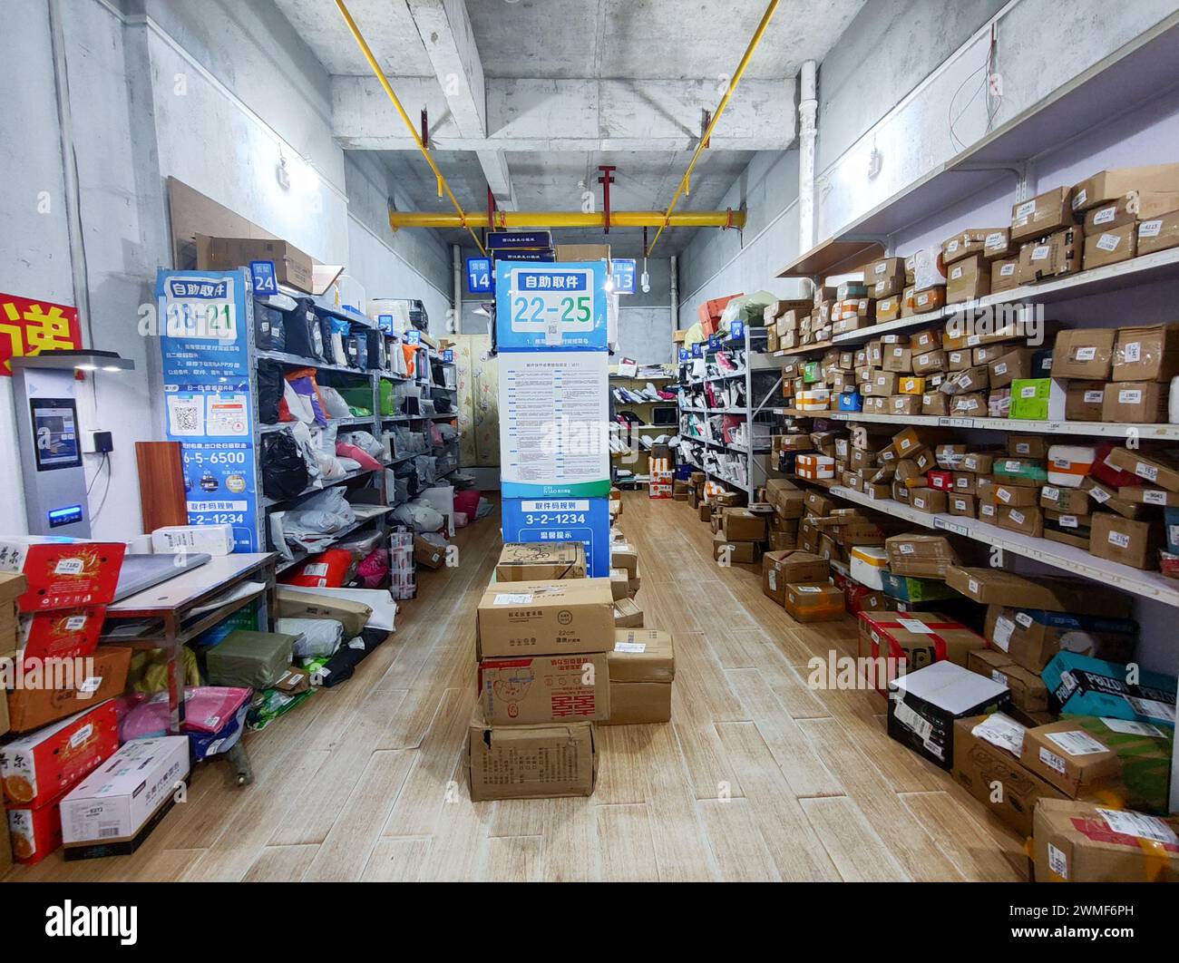 ENSHI, CHINA - FEBRUARY 21, 2024 - A express delivery station is filled ...