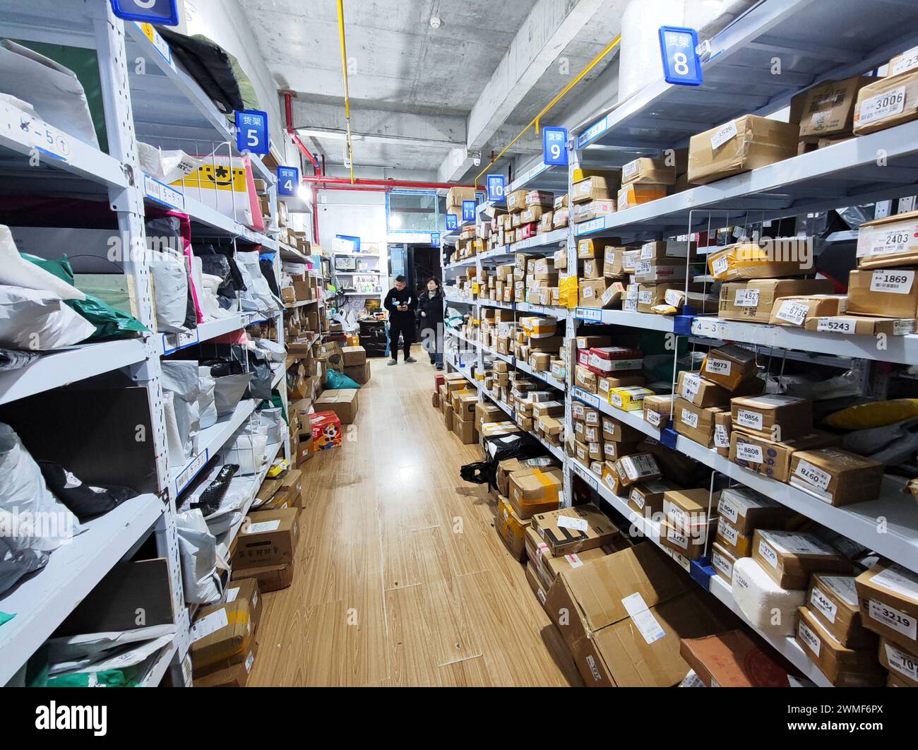 ENSHI, CHINA - FEBRUARY 21, 2024 - A express delivery station is filled ...