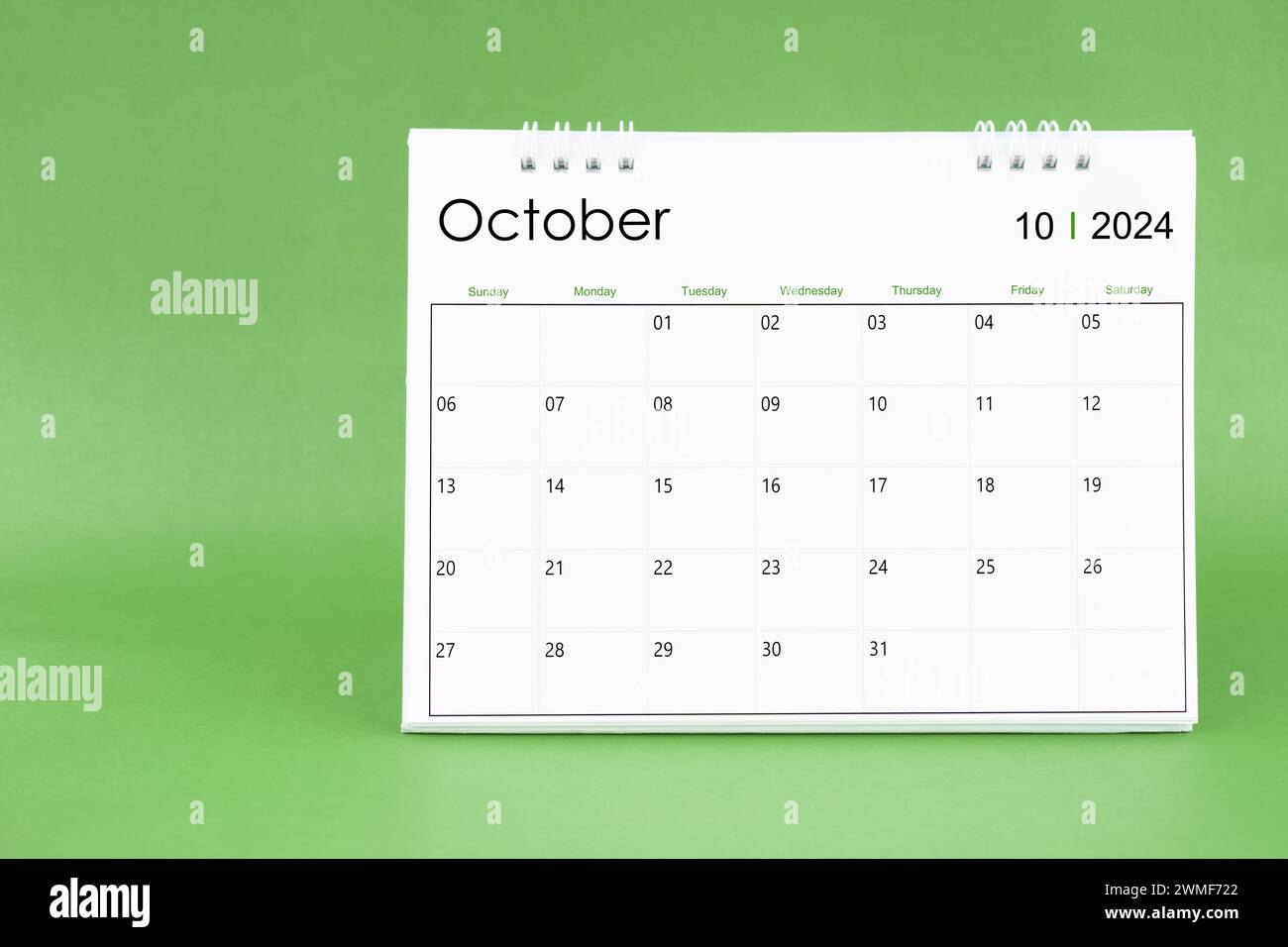 October 2024 desk calendar isolated in green color background Stock ...