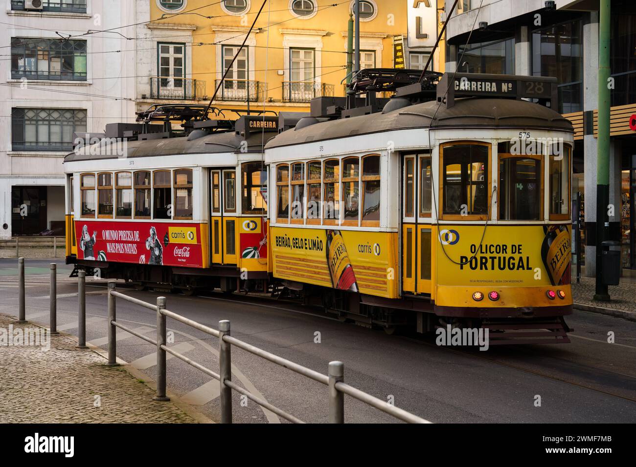 Tram 28, Yellow and Red Trolley Car Traveling Down the Street of Lisbon ...