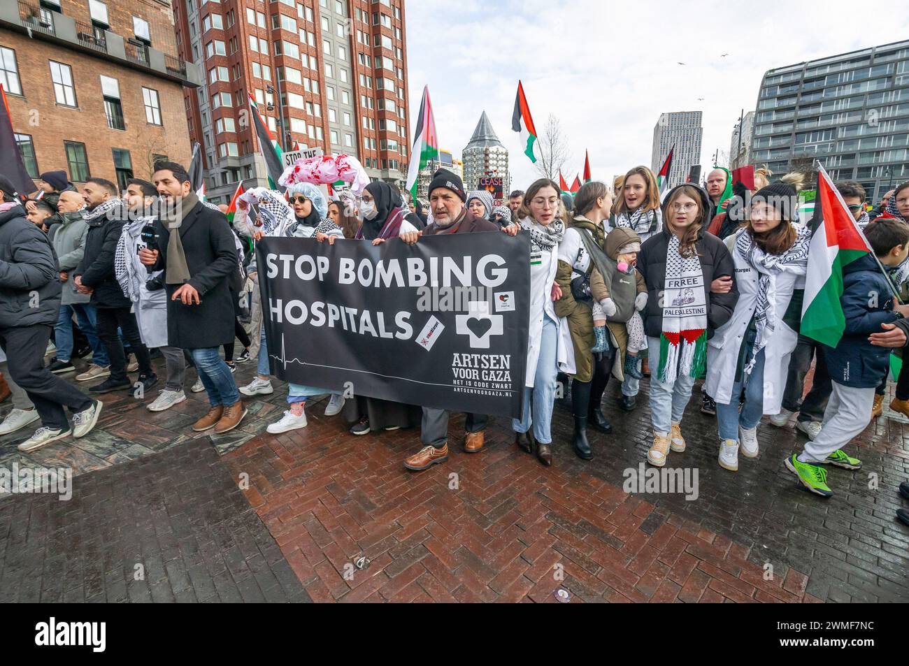Demonstrators hold a banner during the Open Off Rafah protest. HANDS ...