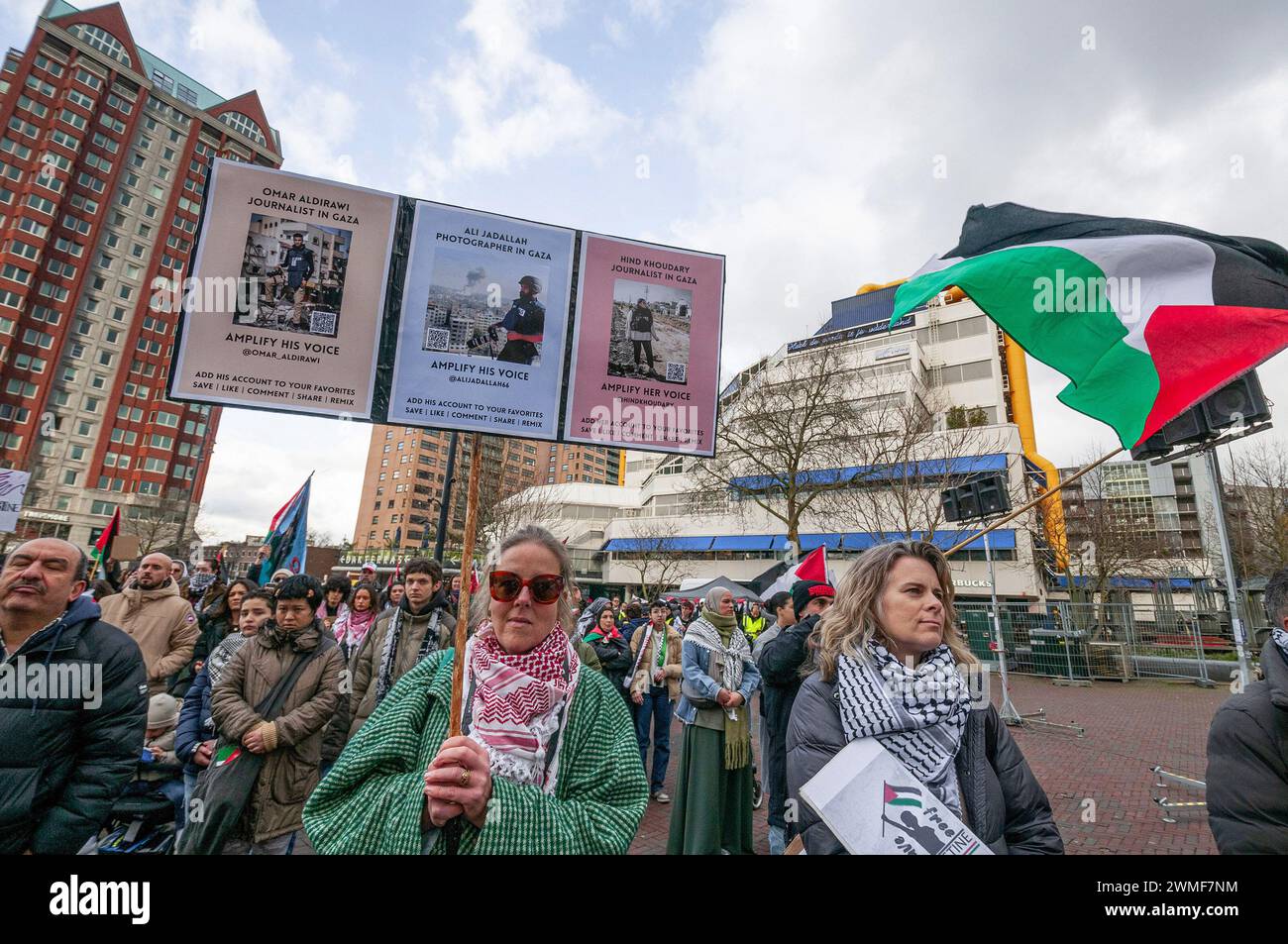 A protester holds a placard during the Open Off Rafah protest. HANDS ...