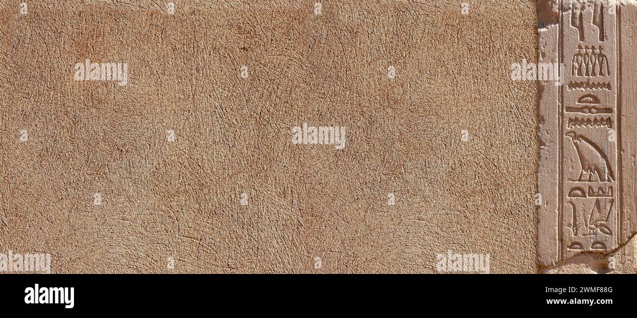 Horizontal background with ancient Egyptian hieroglyphs on stone wall ...