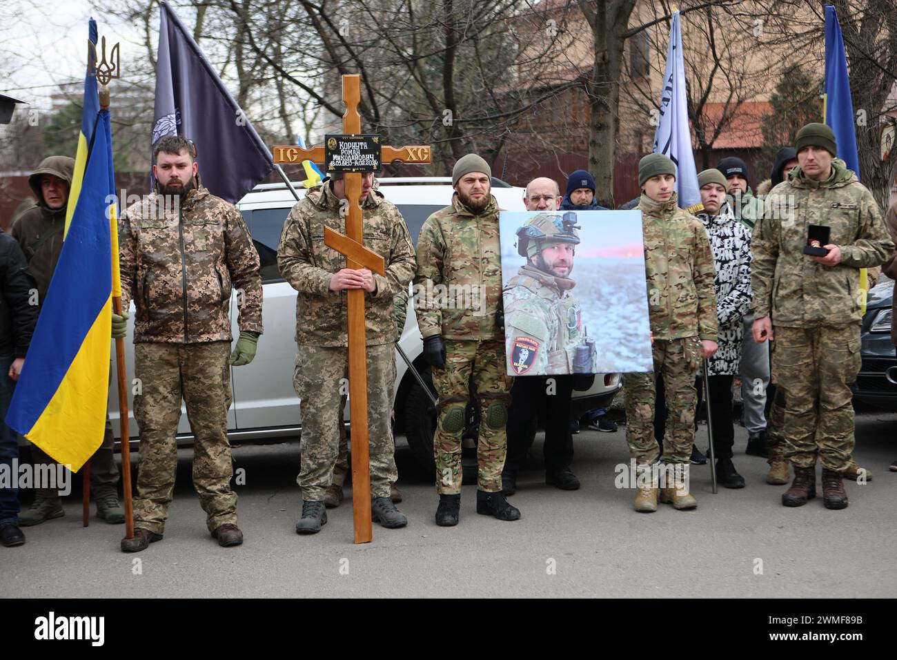 IVANO-FRANKIVSK, UKRAINE - FEBRUARY 19, 2024 - Soldiers hold a portrait ...