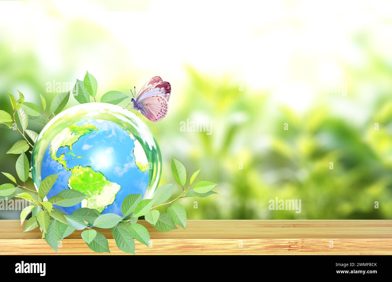 Horizontal banner with Earth in glass ball on green leaves. Ecology, go ...