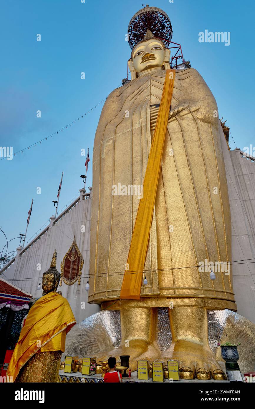 The 32 m high golden statue of a standing Buddha and a major Bangkok ...