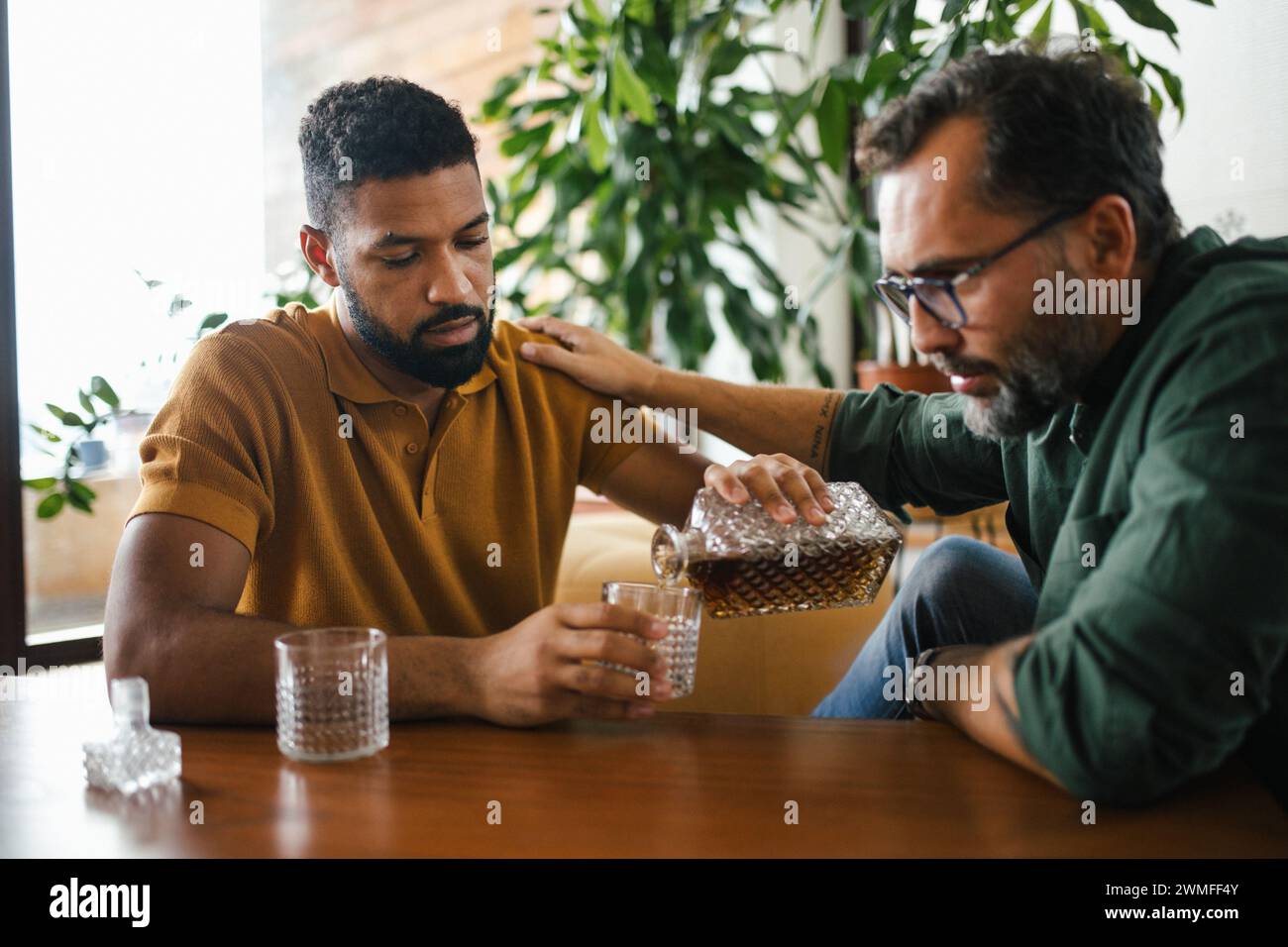 Best friends, supporting each other, drinking whiskey and talking ...