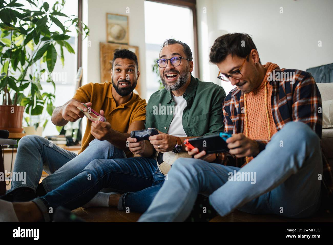 Best friends playing together on a gaming console, competing. Concept ...