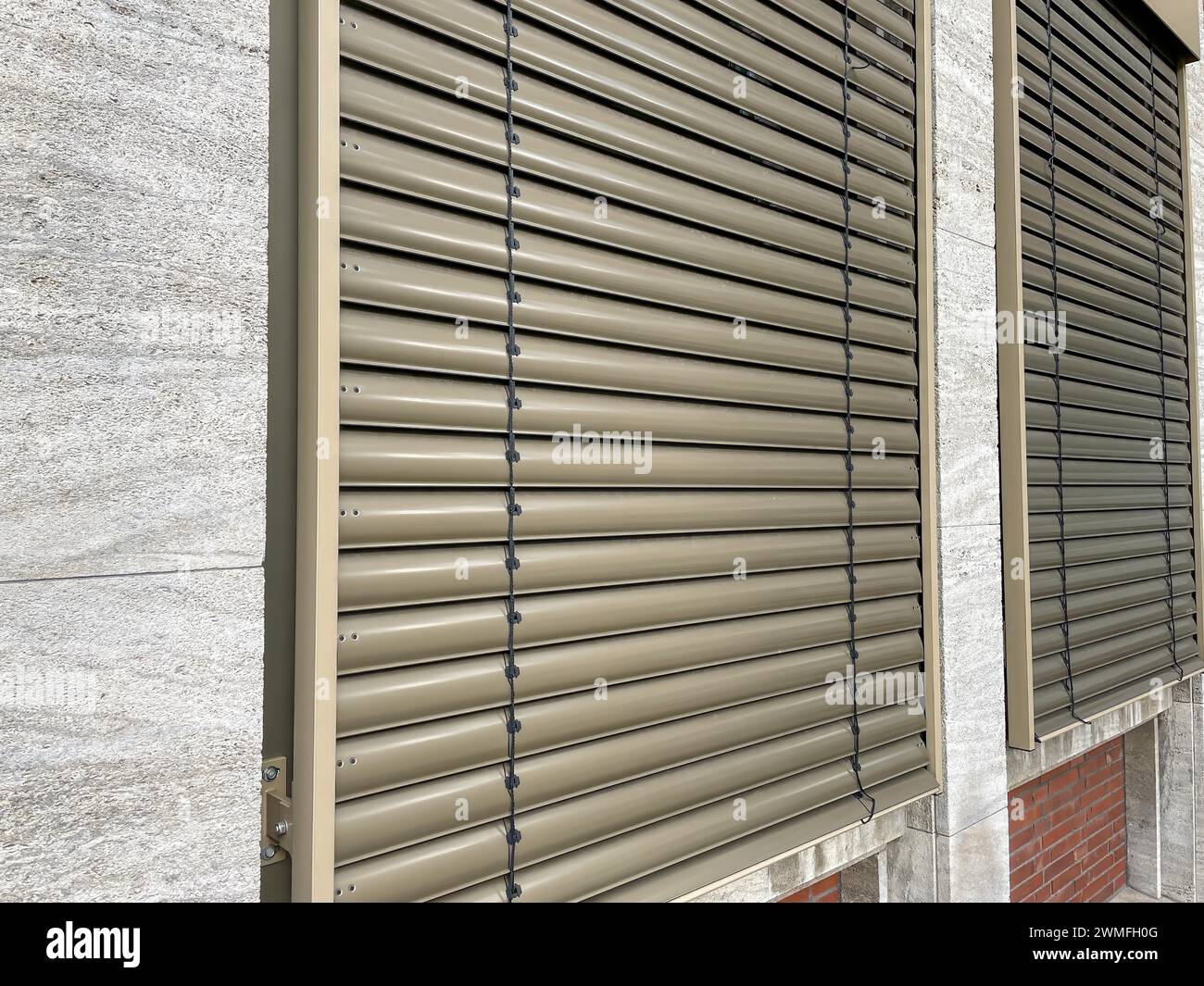 Windows with roller shutters down Stock Photo - Alamy