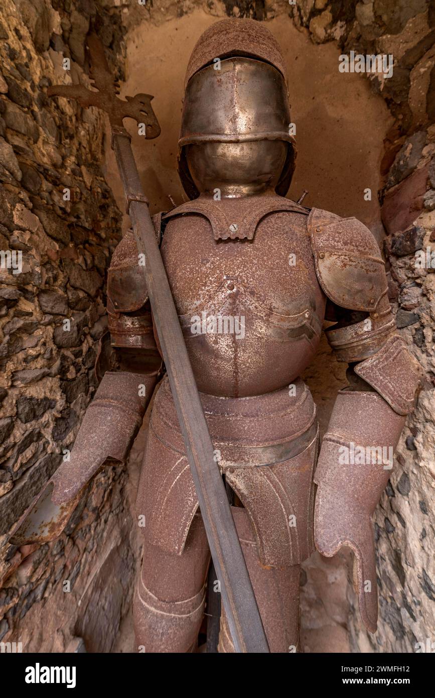 Rusty knight's armour with lance in a niche in the outer bailey ...