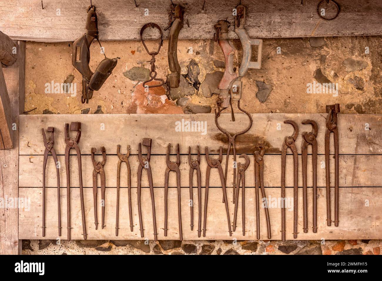 Rusty tongs and tools, blacksmith's forge, blacksmith, inner courtyard ...