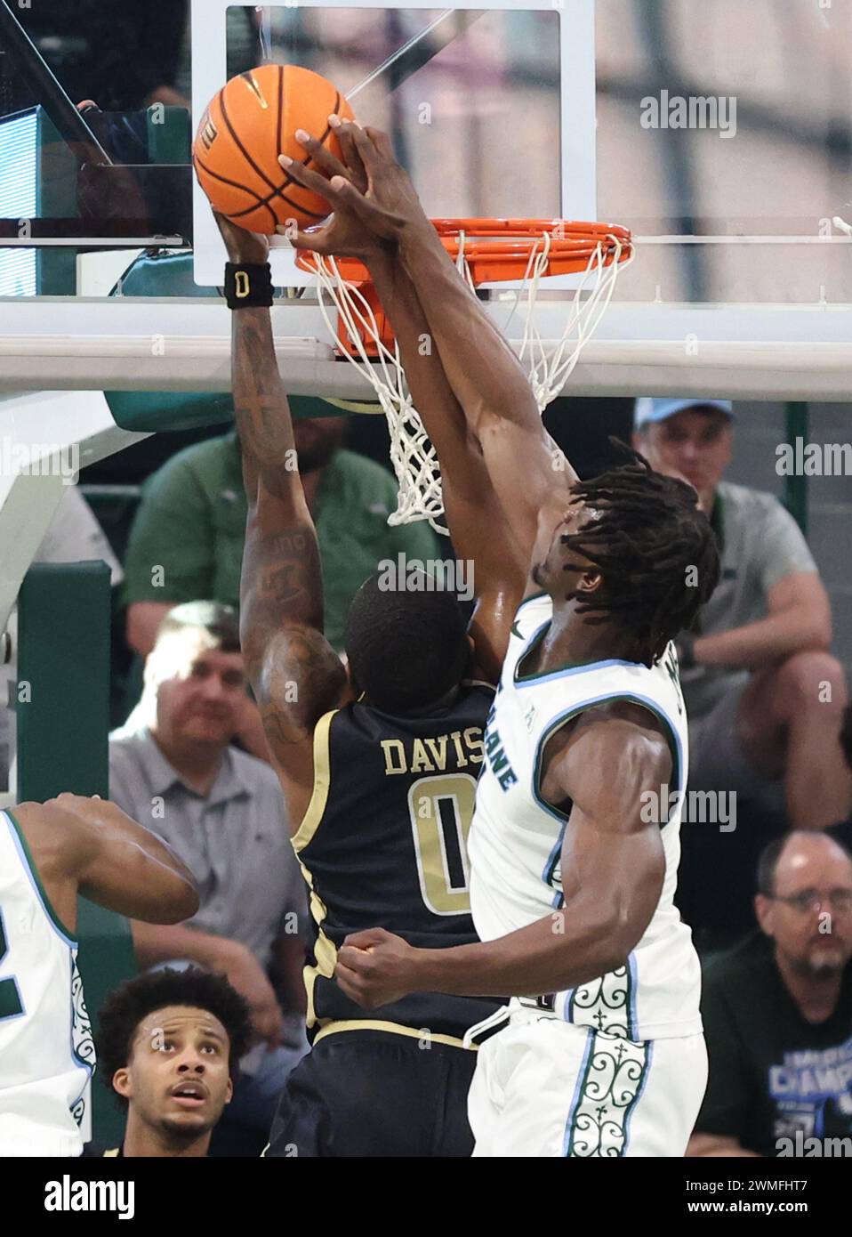 Tulane Green Wave guard Sion James (1) blocks a dunk attempt by UAB ...