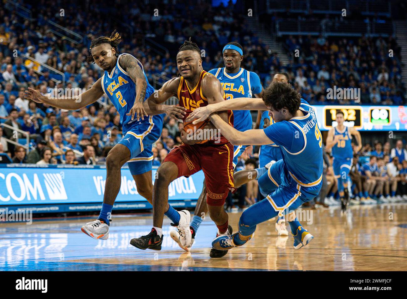 USC Trojans guard Isaiah Collier (1) is fouled by UCLA Bruins forward ...