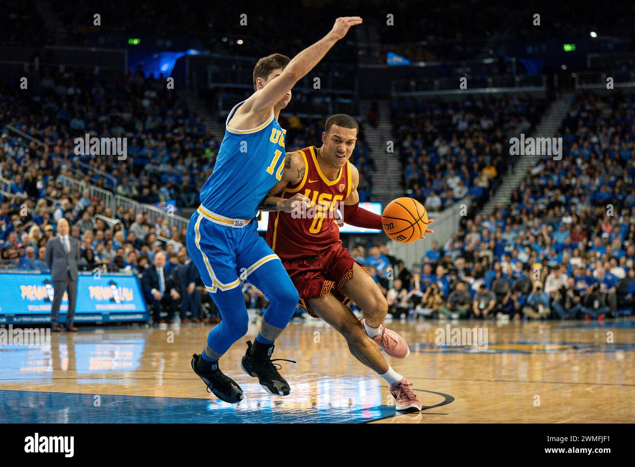 USC Trojans guard Kobe Johnson (0) drives against UCLA Bruins guard ...