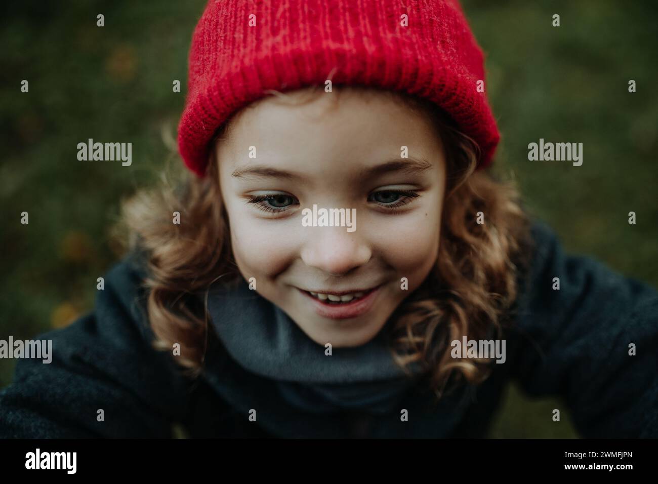 Portrait of little girl in red knitted hat. Red riding hood girl ...