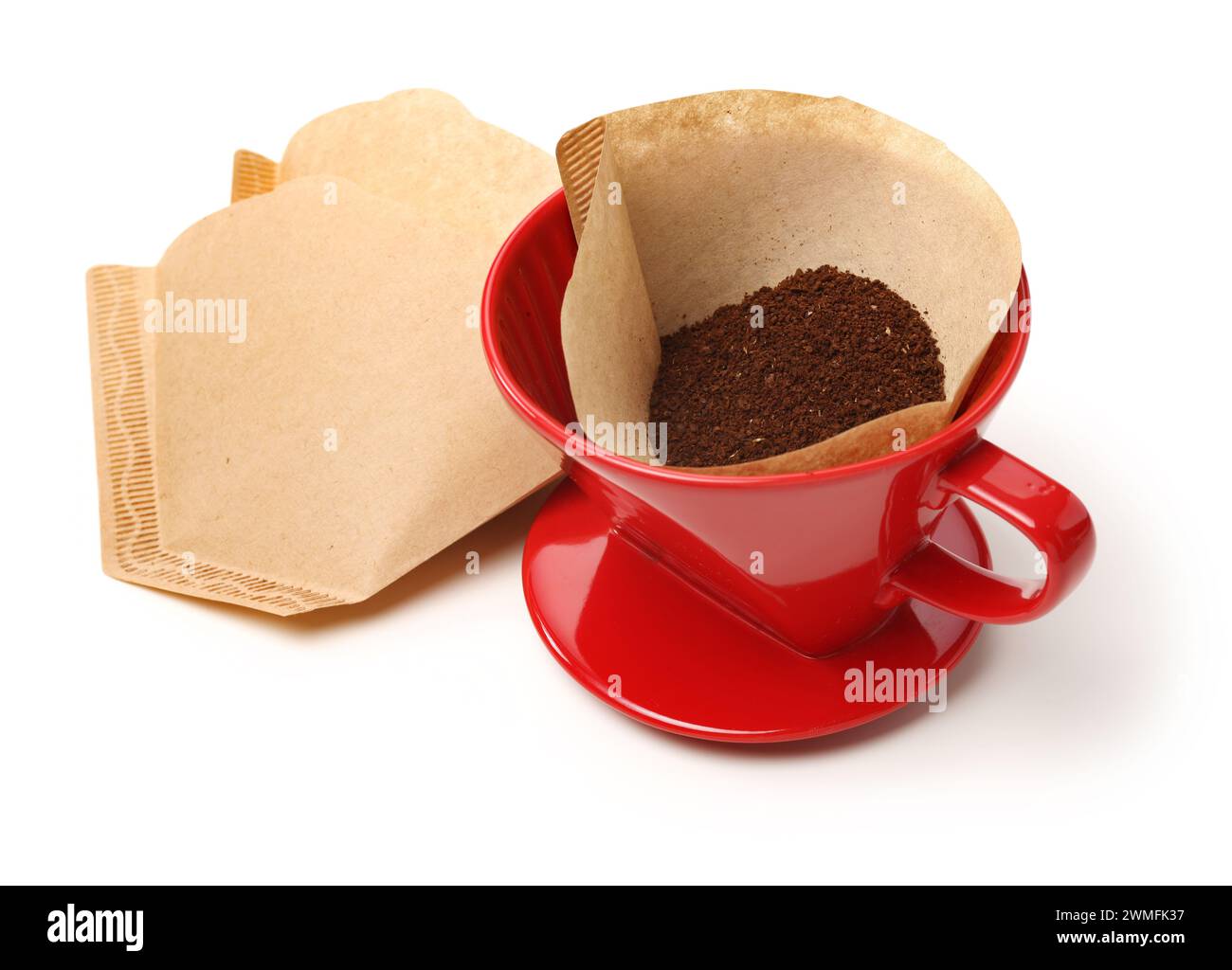 Coffee cone with filter paper full of coffee on white background Stock ...