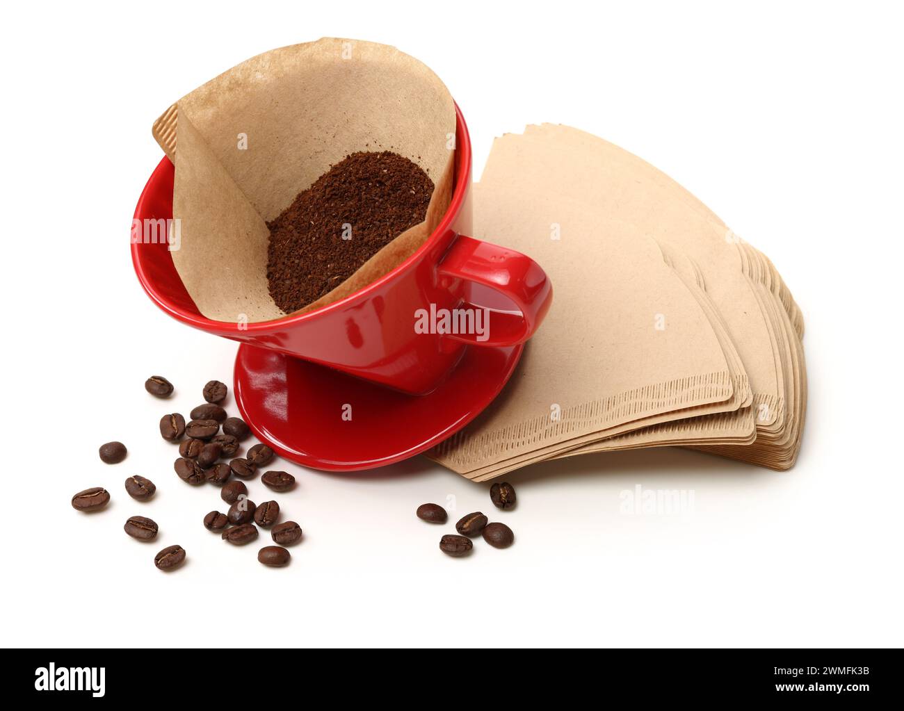 Coffee cone with filter paper full of coffee on white background Stock ...
