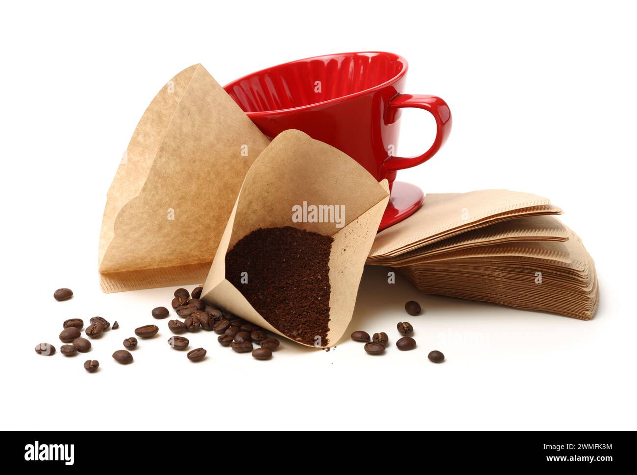 Coffee cone with filter paper full of coffee on white background Stock ...