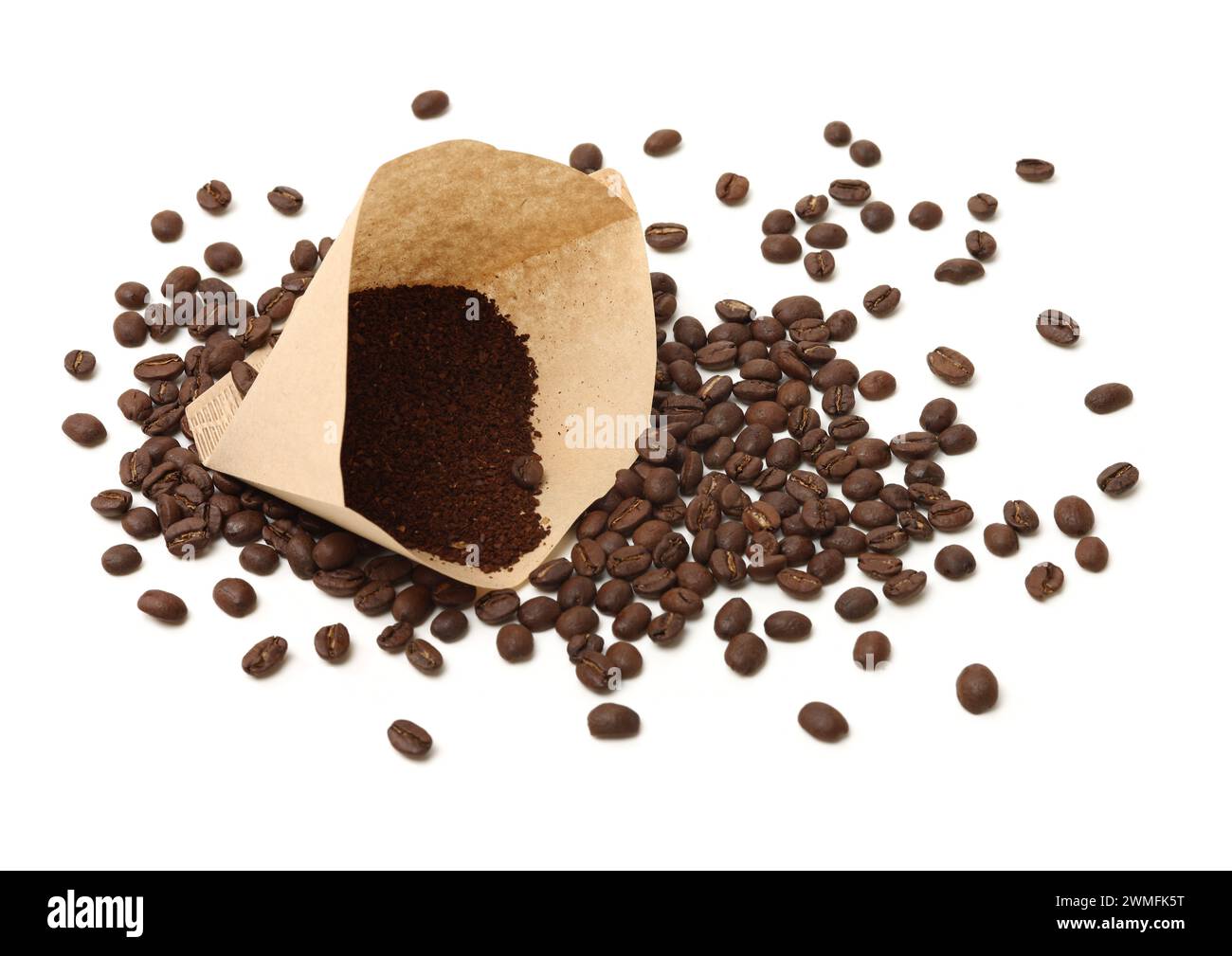 Coffee cone with filter paper full of coffee on white background Stock ...