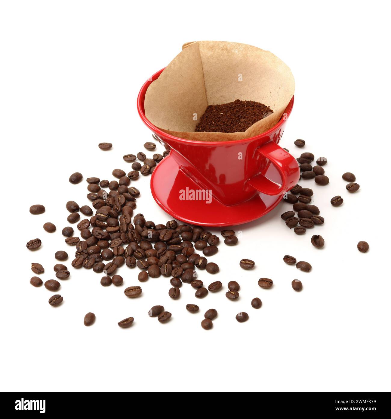 Coffee cone with filter paper full of coffee on white background Stock ...