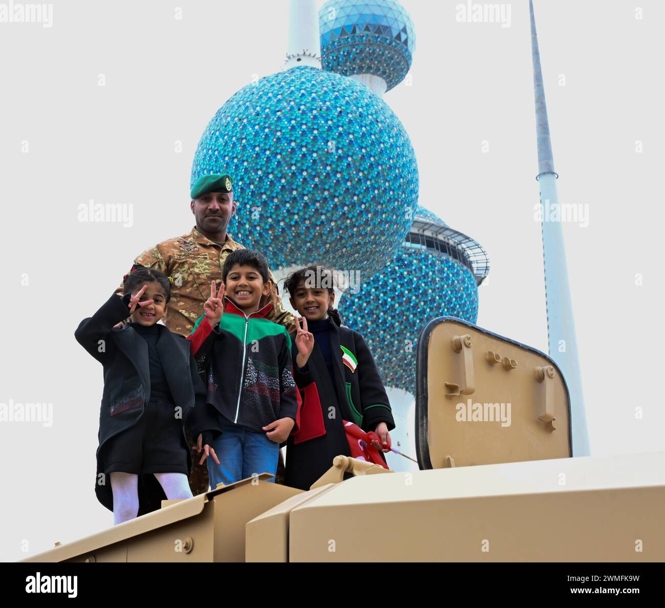 Capital Governorate, Kuwait. 25th Feb, 2024. Kids take photos with a ...