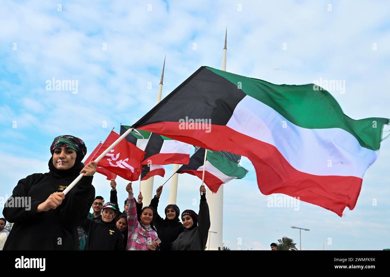 Capital Governorate, Kuwait. 25th Feb, 2024. People carry Kuwait's ...